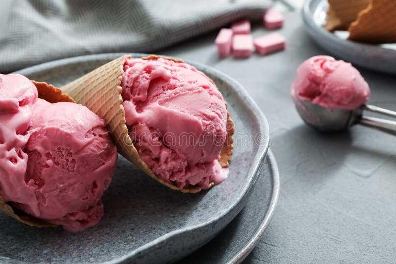 Delicious Pink Ice Cream in Wafer Cones Served on Grey Table, Closeup ...