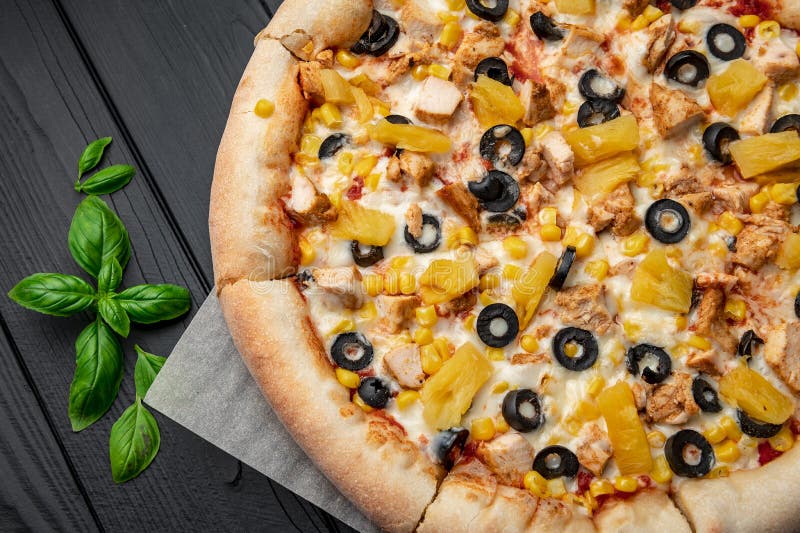 Delicious Pizza with Chicken Meat, Pineapple, Corn and Olives Stock ...