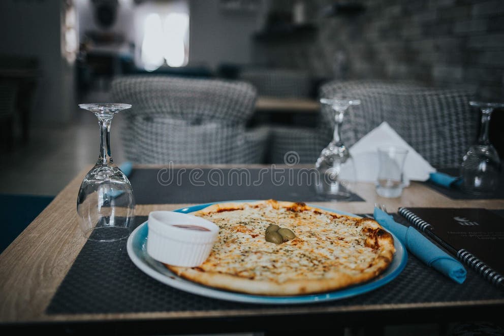 Delicious Pizza on the Restaurant Table Stock Photo - Image of lunch ...