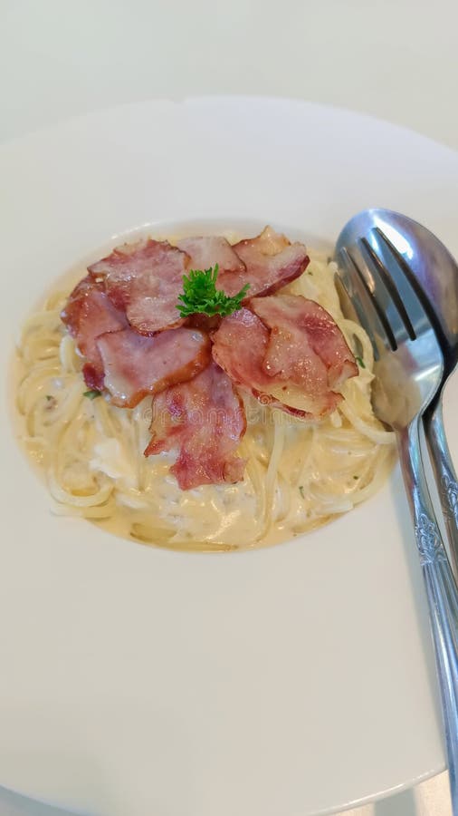 A Delicious Plate of Spaghetti Carbonara Topped with Bacon Stock Image ...
