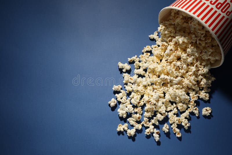 Delicious Popcorn on Blue Background. Space for Text Stock Photo ...