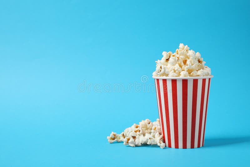 Delicious Popcorn on Light Blue Background. Space for Text Stock Photo ...