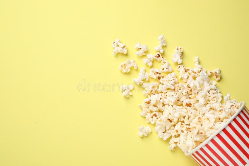 Delicious Popcorn on Yellow Background, Top View. Space for Text Stock ...
