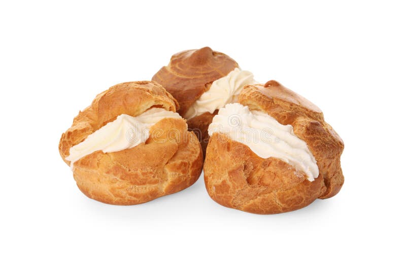 Delicious Profiteroles with Cream Filling on White Background Stock ...