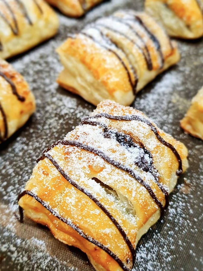 Delicious Puff Pastries Glazed with Chocolate and Sprinkled with ...