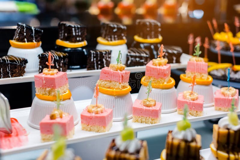 Delicious Reception Candy Bar Dessert Table. Pieces of Sweets Cake ...