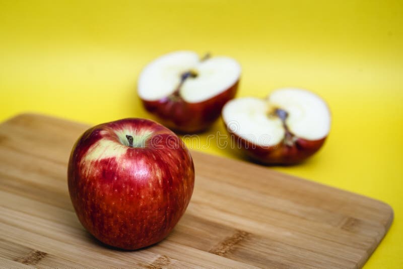 Delicious Red Apple Next To Slices of Another Apple Stock Image - Image ...