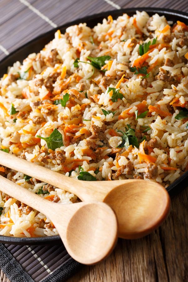 Delicious Rice with Minced Meat and Carrots Close-up on a Plate. Stock ...