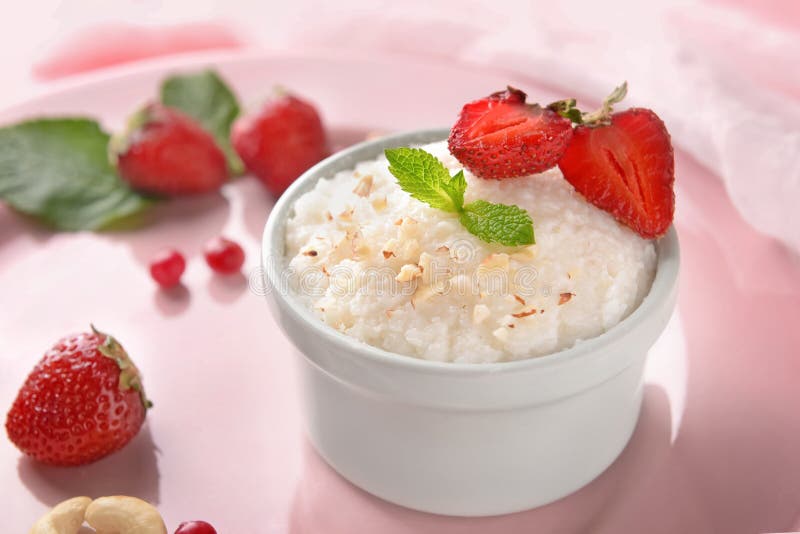 Delicious Rice Pudding with Berries in Bowl on Color Plate Stock Image ...