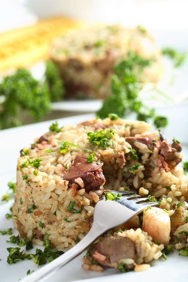 Delicious Risotto On The Black Ceramic Plate Topped With Shaved Cheese ...