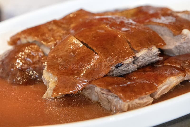 Delicious Roasted Golden Goose is Cut into Pieces and Placed on a Plate ...