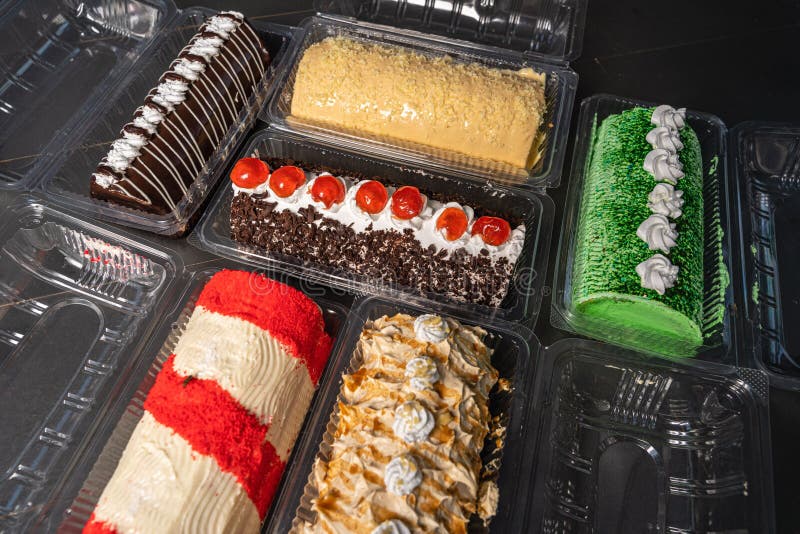 Delicious Roll Cakes in Plastic Containers Stock Photo - Image of cakes ...