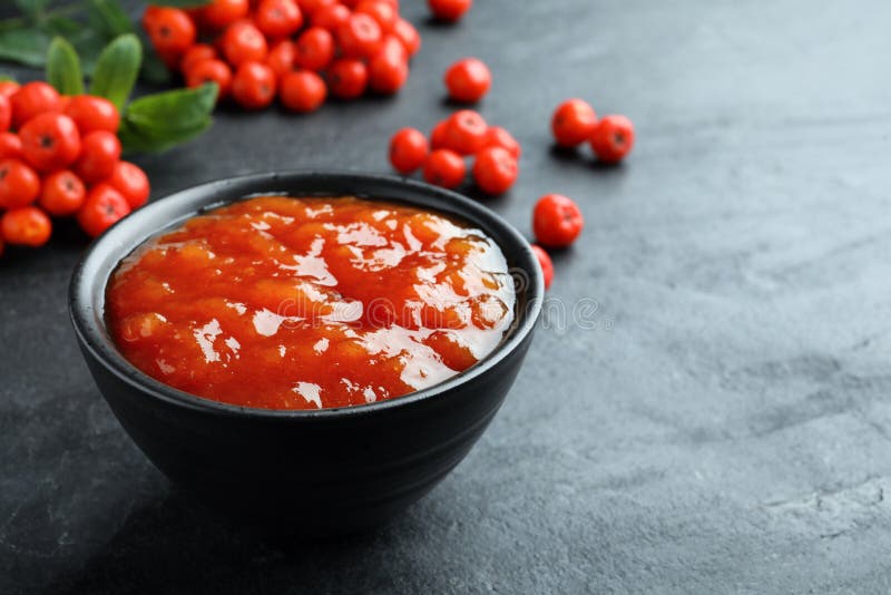 Delicious Rowan Jam in Bowl on Dark Table. Space for Text Stock Photo ...