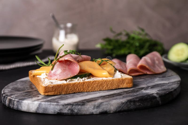 Delicious Sandwich with Ham on Black Table Stock Image - Image of board ...