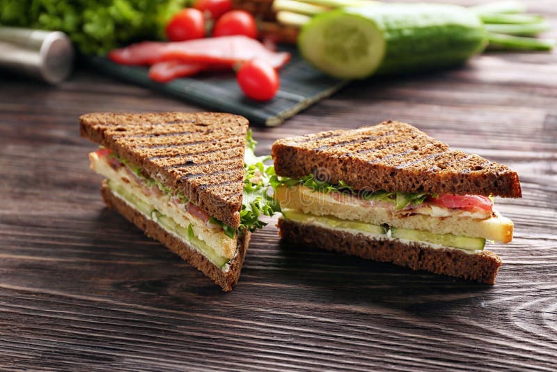 Delicious Sandwiches on Wooden Table Stock Image - Image of table ...