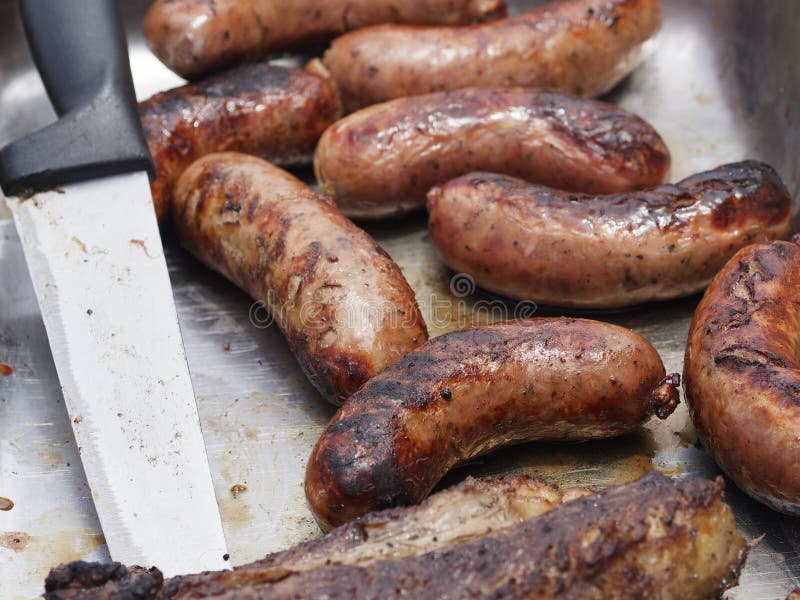 Delicious Sausage on Grill with Spices and Herbs Stock Photo - Image of ...