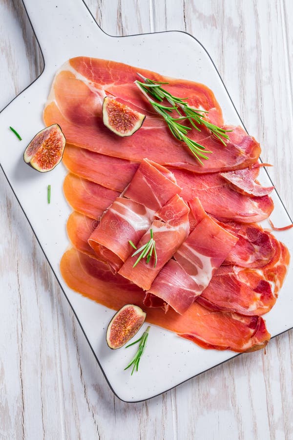 Delicious Serrano Ham with Fresh Figs and Rosemary Stock Photo - Image ...