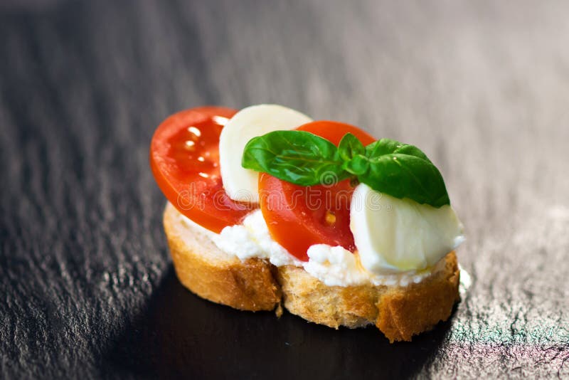Delicious Slice of Bread with Buffalo Mozzarella, Tomatoes and Fresh ...