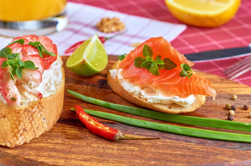 Delicious Snacks with Shrimp, Fish and Avocado Stock Image - Image of ...