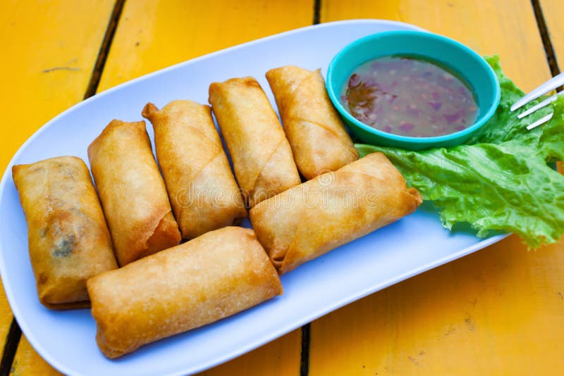 Delicious Spring Rolls on a Yellow Table - Happy Meal Stock Photo ...