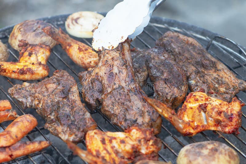 Delicious Steaks with Chicken Wings on the Grill Stock Photo - Image of ...