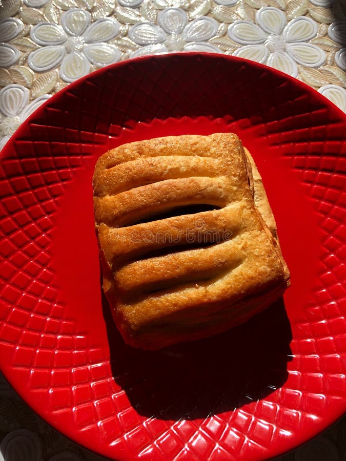 Delicious Strudel with Cherry Jam on a Red Plate Stock Image - Image of ...