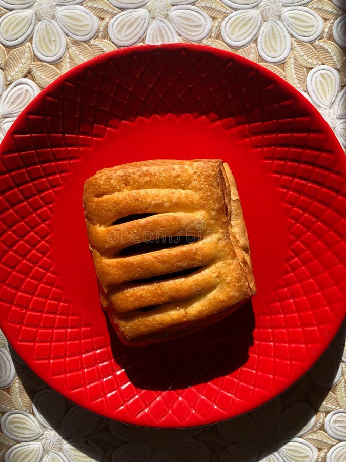 Delicious Strudel with Cherry Jam on a Red Plate Stock Image - Image of ...