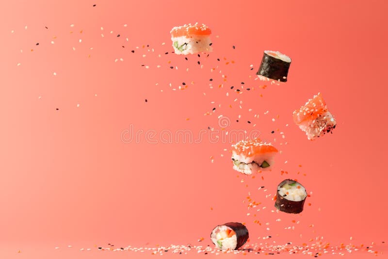 Delicious Sushi Pieces Falling Gracefully Against Solid Color ...