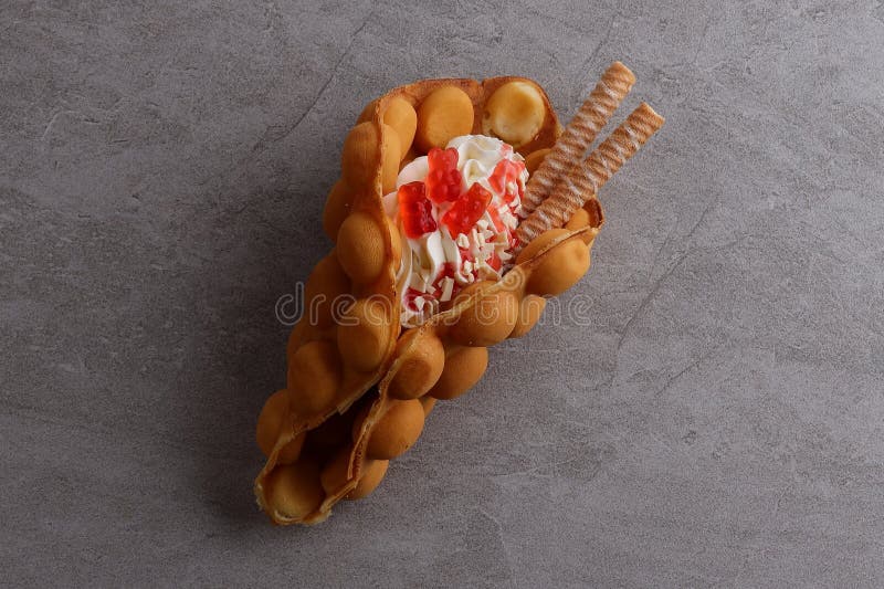 Delicious Sweet Bubble Waffle on Table Stock Image - Image of cream ...