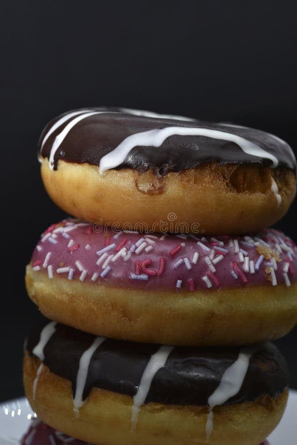 Delicious Sweet Donuts on a Plate. Glazed Doughnuts Stock Photo - Image ...