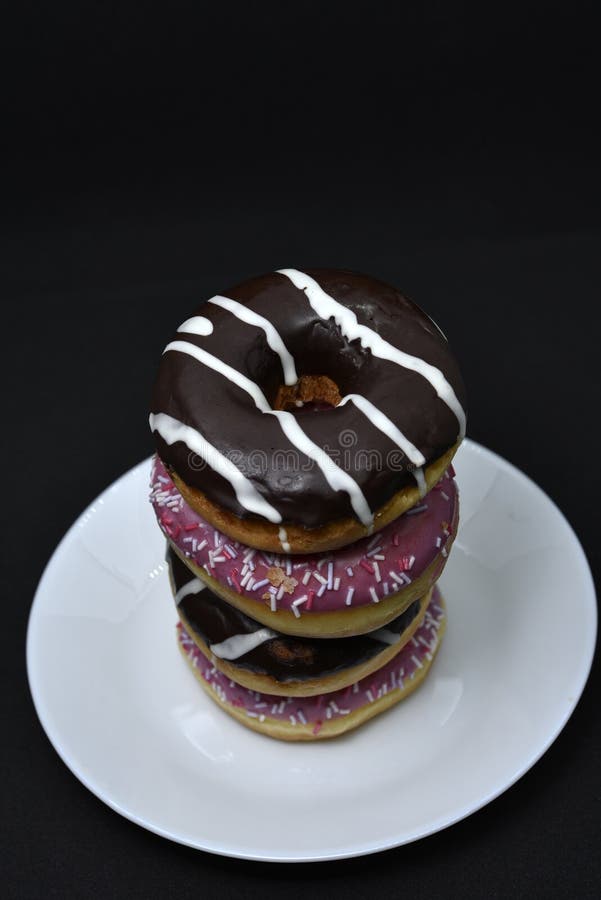 Delicious Sweet Donuts on a Plate. Glazed Doughnuts Stock Photo - Image ...