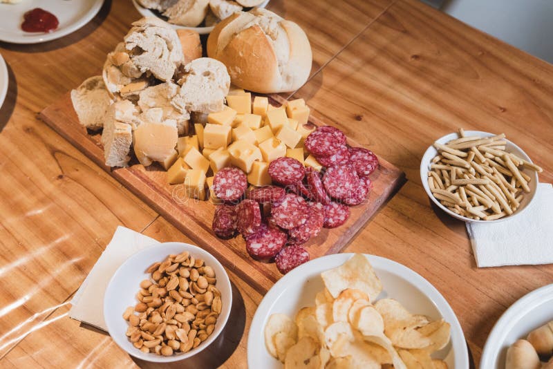 Delicious Table of Snacks and Appetizers with Cheese, Salami, Chips and ...