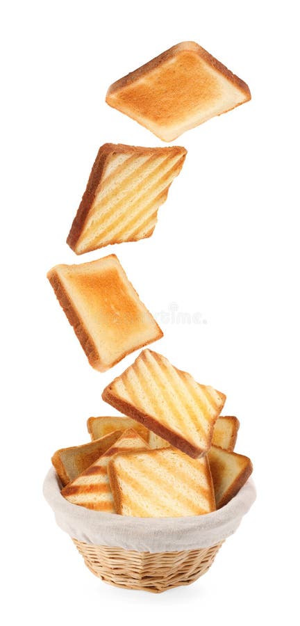 Delicious Toasted Bread Falling into Basket on White Background Stock ...