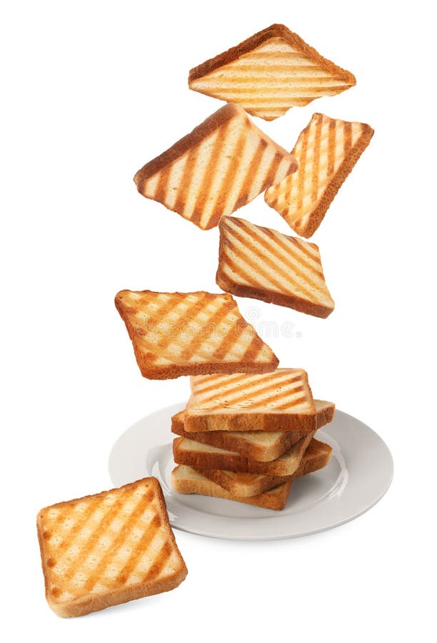 Delicious Toasted Bread Falling into Plate on White Background Stock ...
