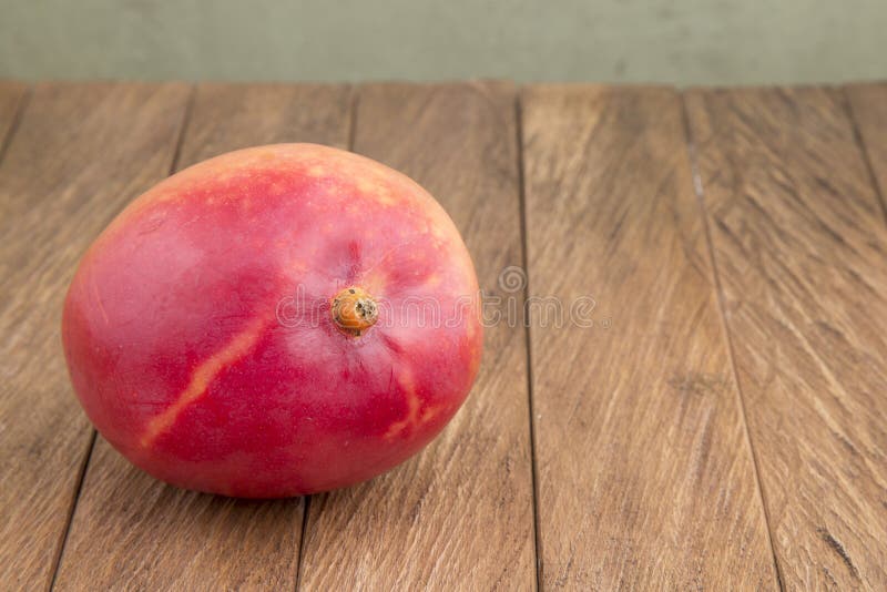 Delicious Tommy Mango on Wooden Table - Mangifera Indica Stock Image ...