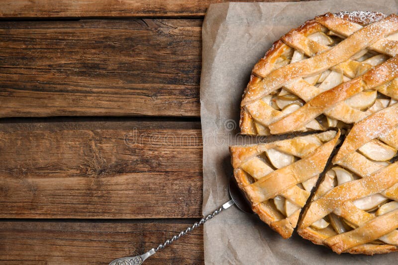 Delicious Traditional Apple Pie on Wooden Table, Top View. Space for ...