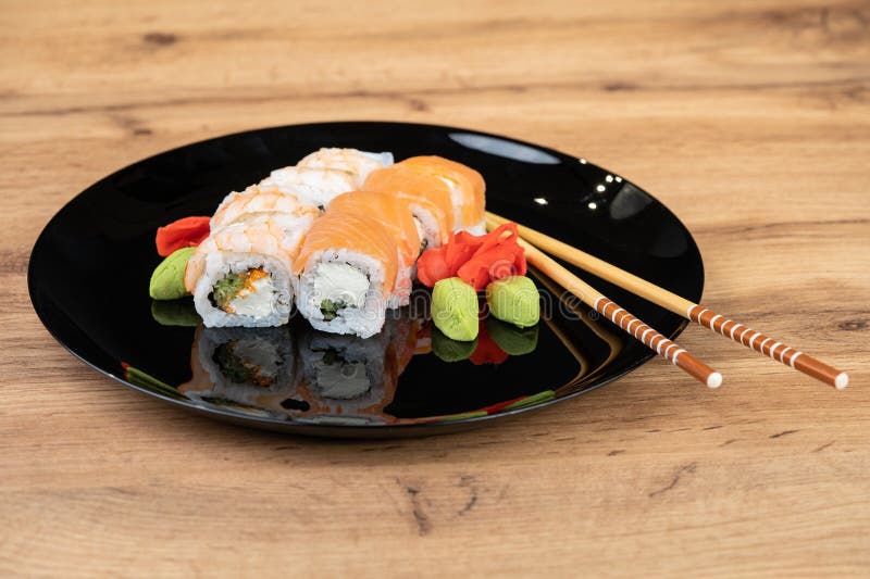 Delicious Traditional Japanese Sushi and Rolls on a Plate Stock Photo ...