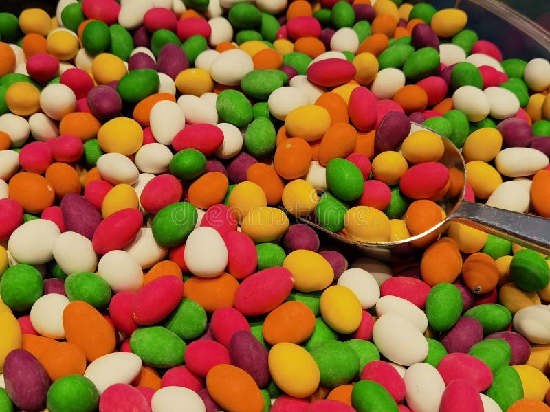 Delicious Treats in Many Colors in a Basket Stock Photo - Image of ...