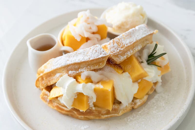 Delicious Waffle Mango Dessert with Young Coconut and Whipped Cream ...
