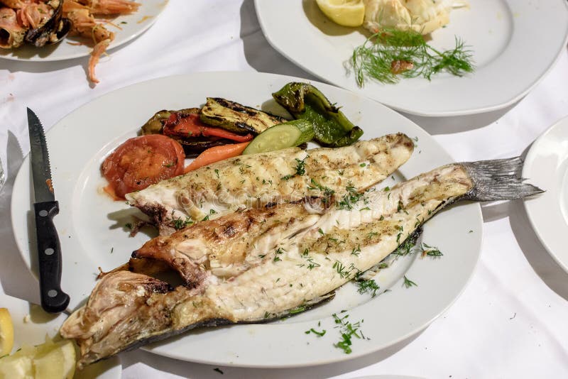 Delicious White Grilled Fish with Garnish of Vegetables Stock Photo ...