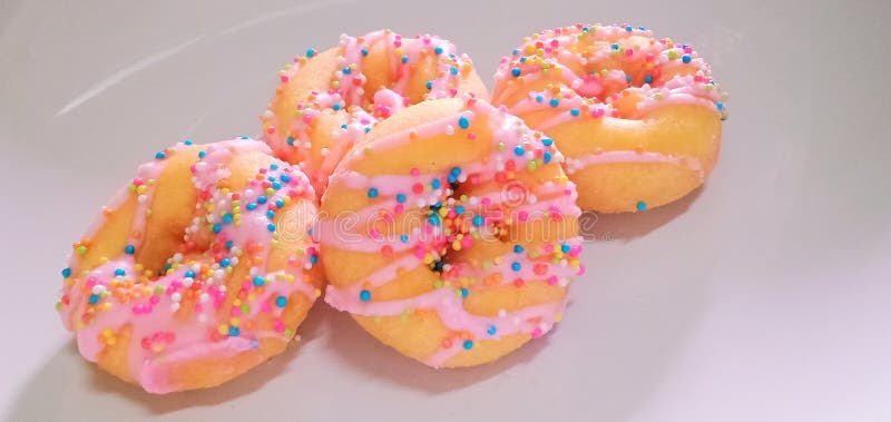 Deliciously colored donuts stock photo. Image of sweet - 234048256
