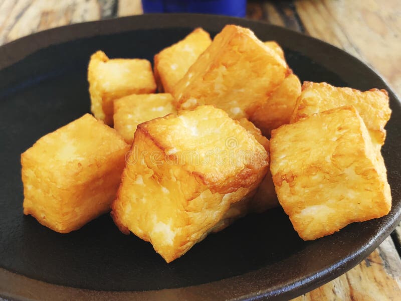 Deliciously Fried Cheese Cubes on a Dark Plate. Stock Photo - Image of ...