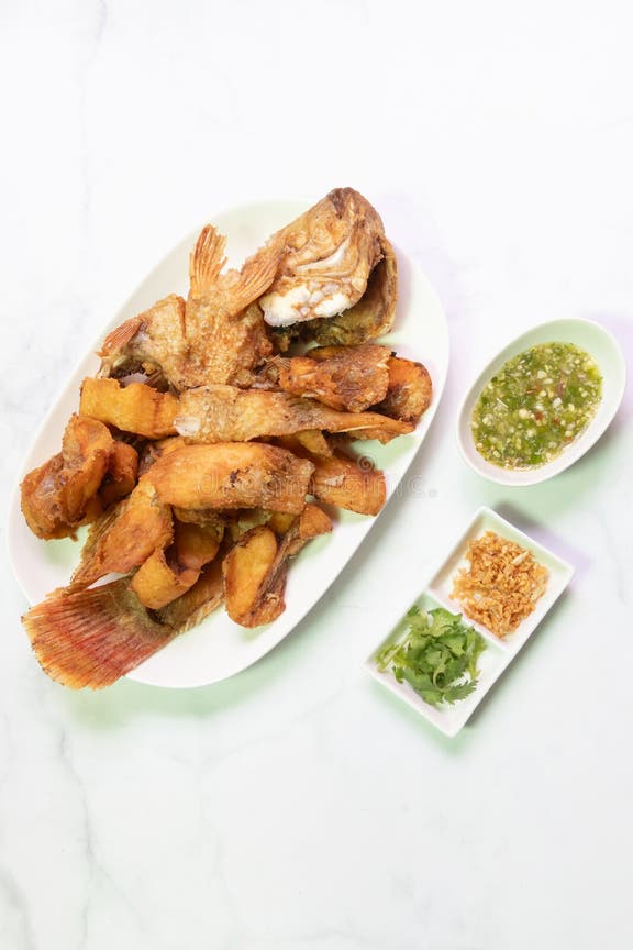 Deliciously Fried Ruby Fish Served with Spicy Sauce Stock Photo - Image ...