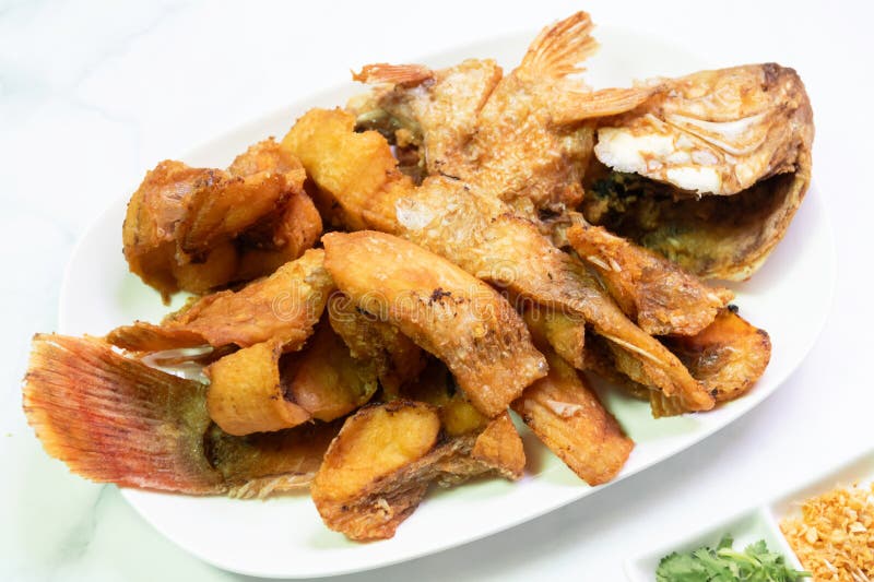 Deliciously Fried Ruby Fish Served with Spicy Sauce Stock Photo - Image ...