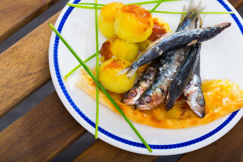 Deliciously Fried Sprats with Scone and Potato Croquettes on Plate ...