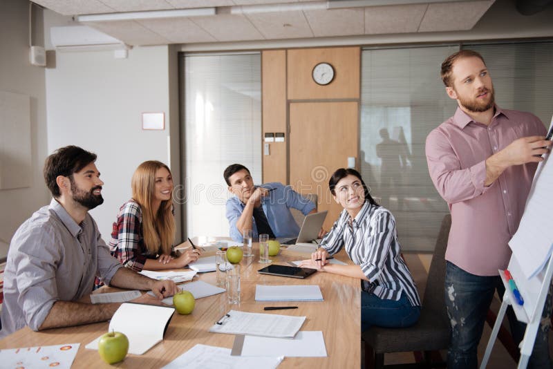 Delighted Group of Colleagues Looking at Board for Presentations Stock ...