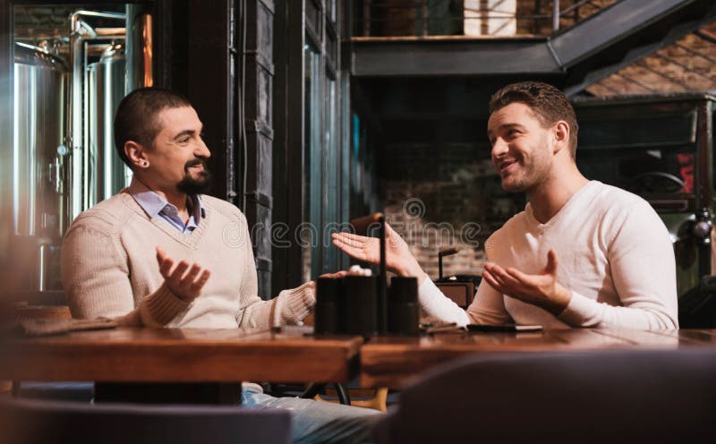 Delighted Handsome Men Looking at Each Other Stock Photo - Image of ... Delighted Handsome Men Looking at Each Other Stock Photo - Image of ...