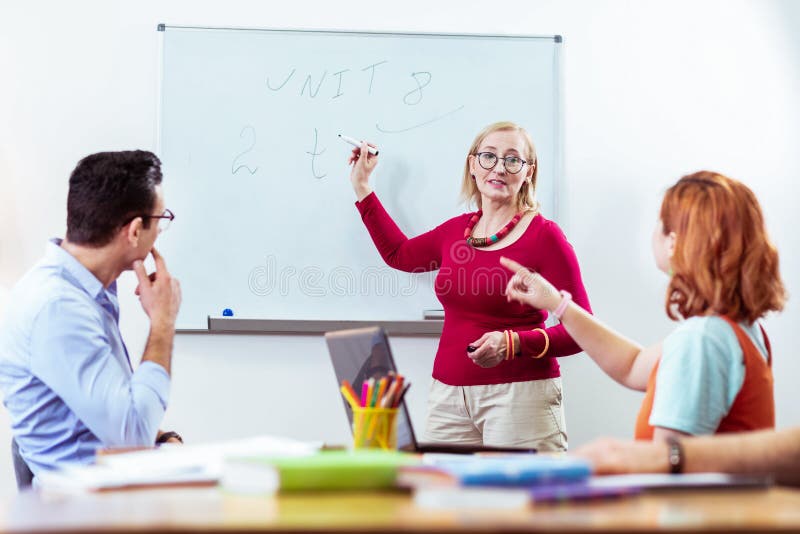 Delighted Nice Students Pointing at the Whiteboard Stock Photo - Image ...