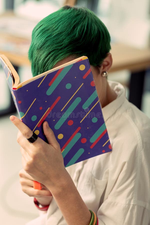 Delighted Nice Woman Covering Her Face with a Notebook Stock Photo ...