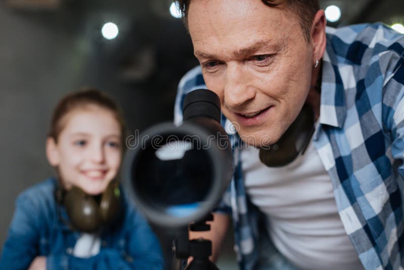 Delighted Positive Man Using the Telescope Stock Photo - Image of ...